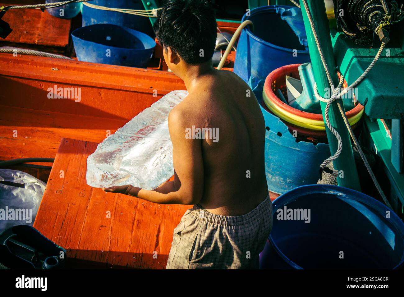 Preak Svay, Koh Rong Island, Cambodia, February 6, 2025 Fisherman in an ...