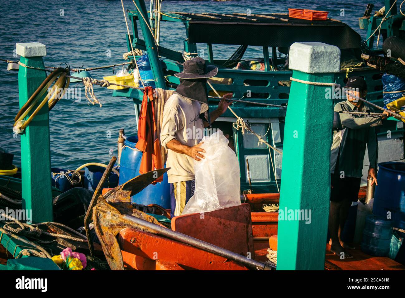 Preak Svay, Koh Rong Island, Cambodia, February 6, 2025 Fisherman in an ...