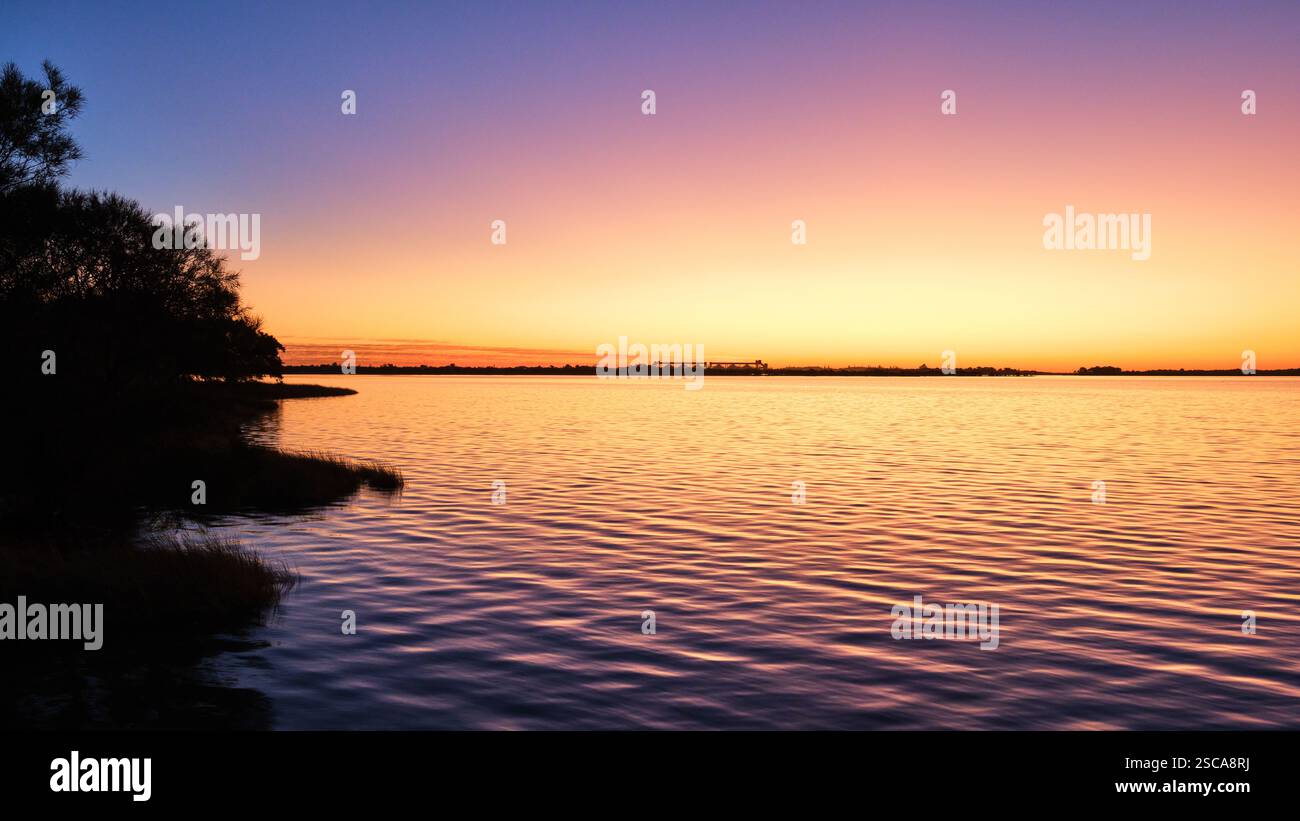 The afterglow following sunset on Leschenault Estuary in the town of ...