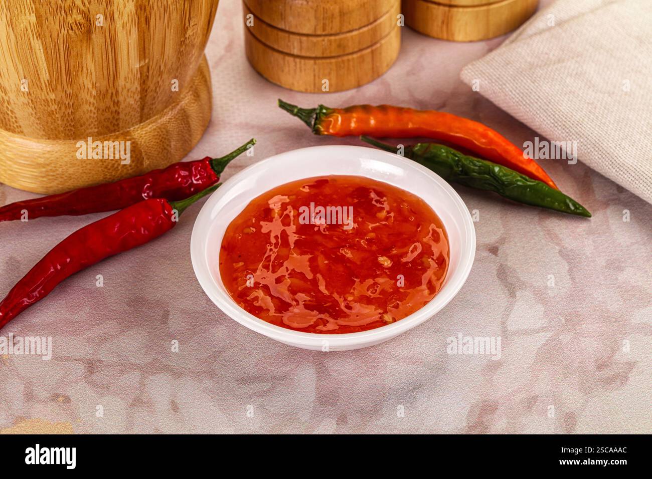 Sweet and sour chili sauce with pineapple pieces Stock Photo - Alamy