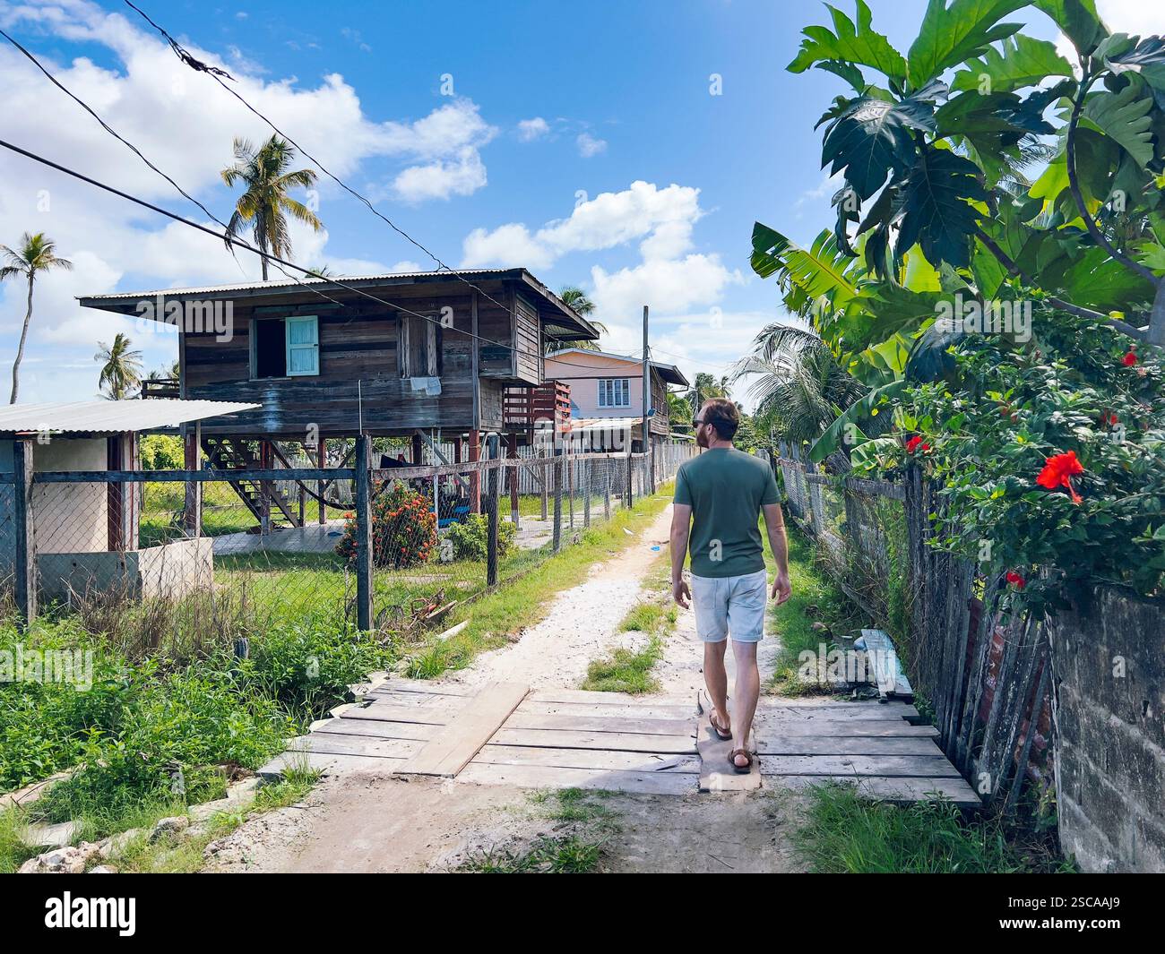 A tourist man explores a small town in Guyana Stock Photo - Alamy