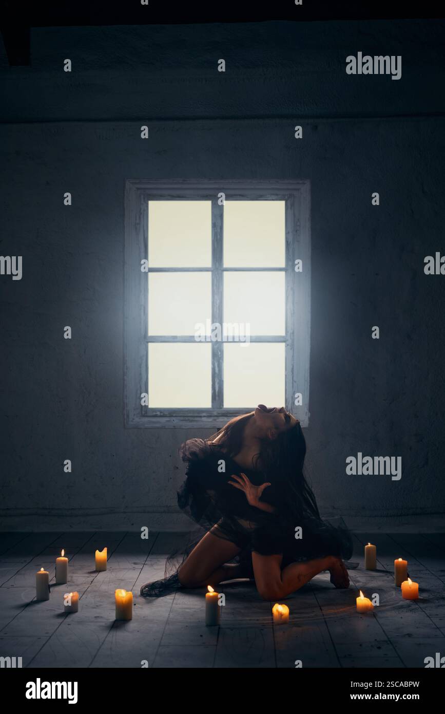 Exorcism. Terrifying shouting woman with dark hair, covered with ...