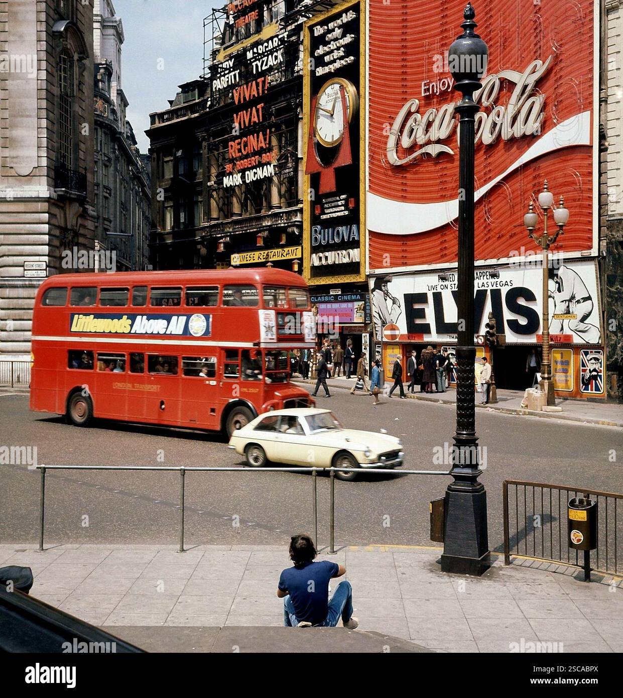 Piccadilly Circus in London: Picture shows a double decker bus, a MG ...