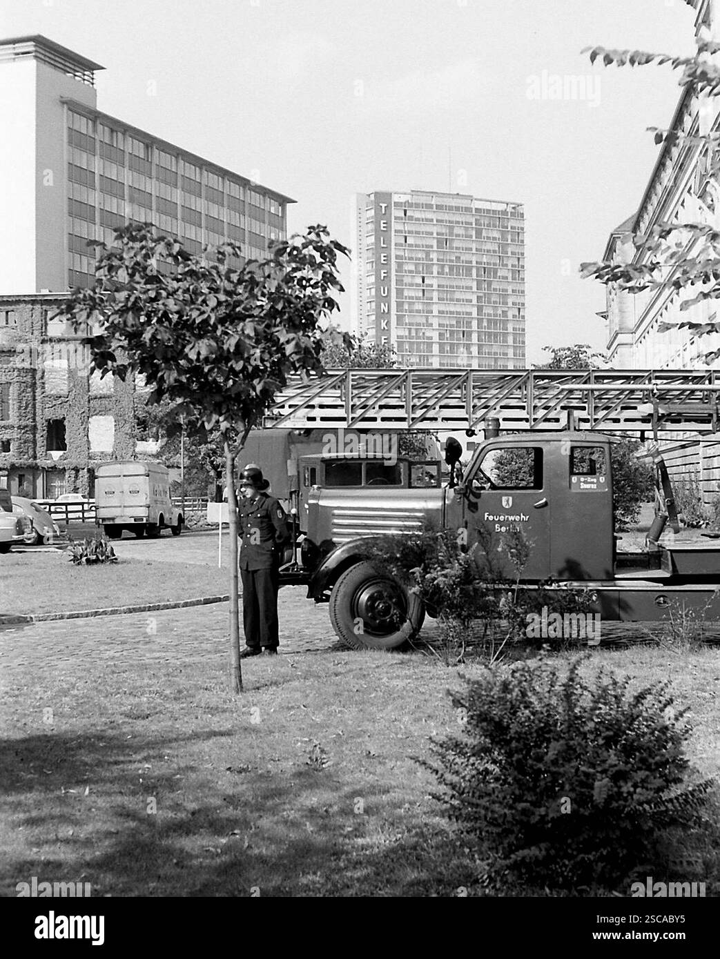 Fireman in front of fire truck Black and White Stock Photos & Images ...