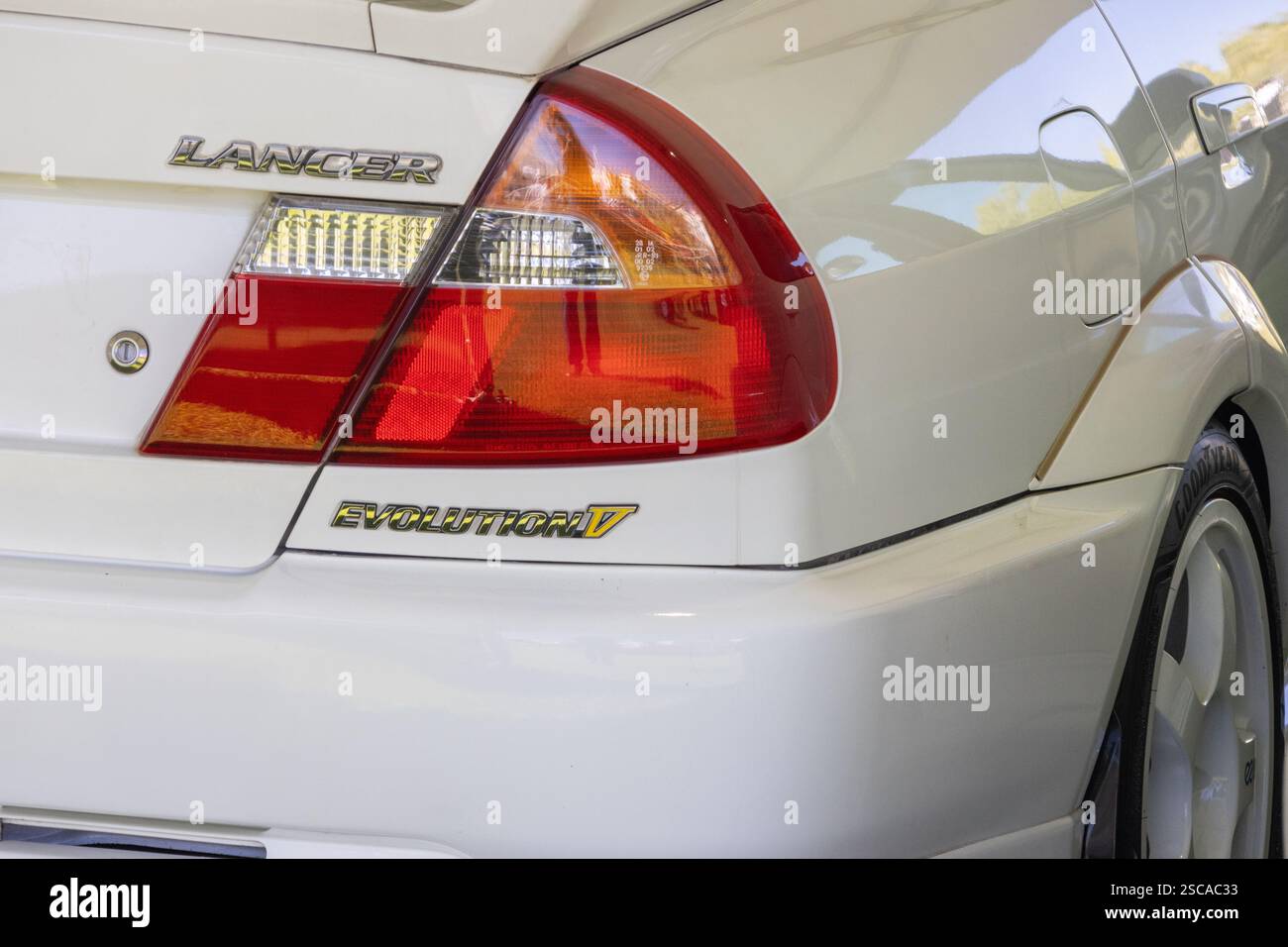 Closeup of the rear of a white mitsubishi lancer evolution iv focusing ...