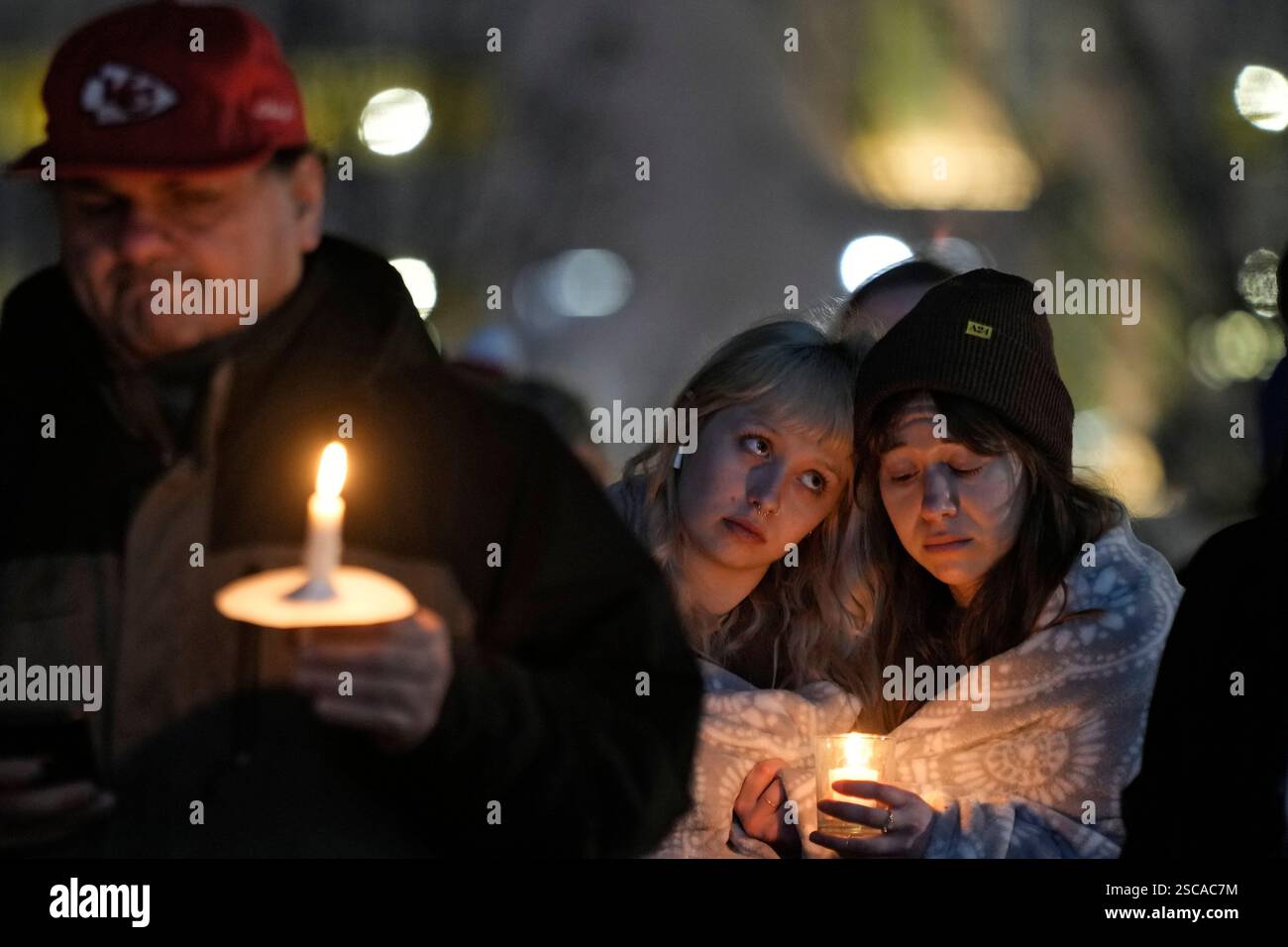 FILE - People attend a candlelight vigil for victims of a shooting at a ...