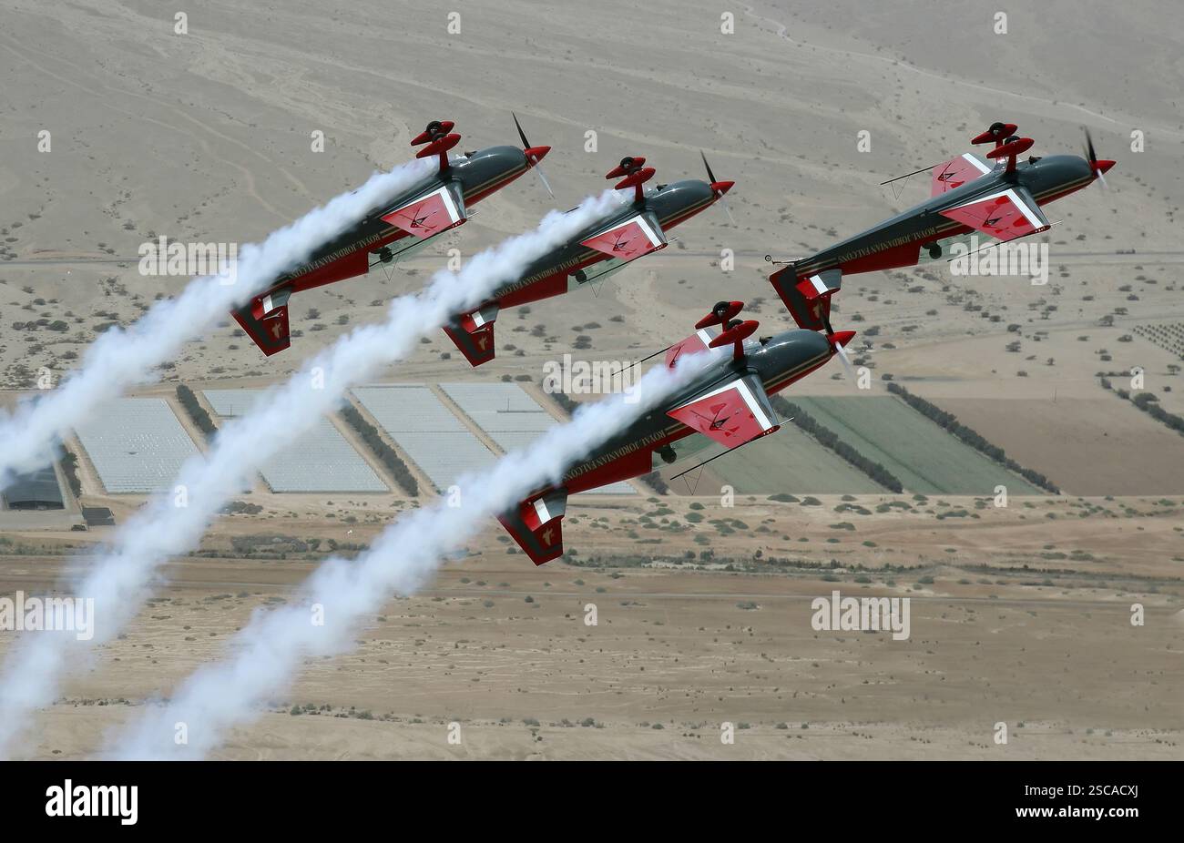 Royal Jordanian Falcons, flying the Extra EA-300LP, executing ...