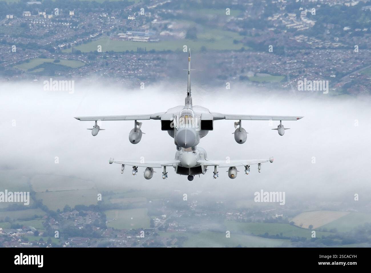 Royal Air Force Tornado and Typhoon performing a 2-ship formation maneuver. The Tornado is a ...