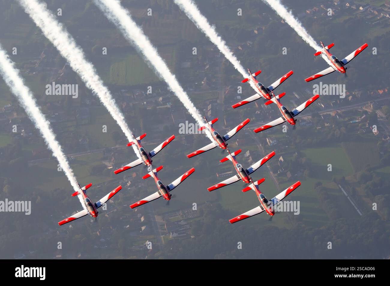The Swiss Air Force PC-7 Team performing aerobatic maneuvers in their ...