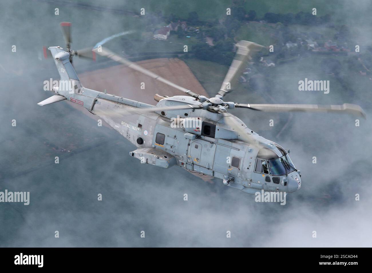 Royal Navy Merlin helicopter conducting a troop insertion Stock Photo ...