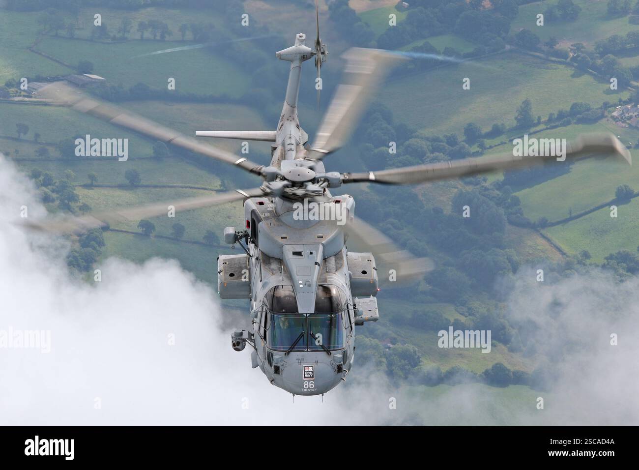 Royal Navy Merlin helicopter conducting a vertical replenishment Stock ...