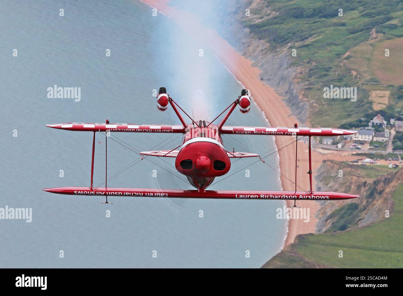 A Pitts Special performing a barrel roll during an air-to-air photo ...