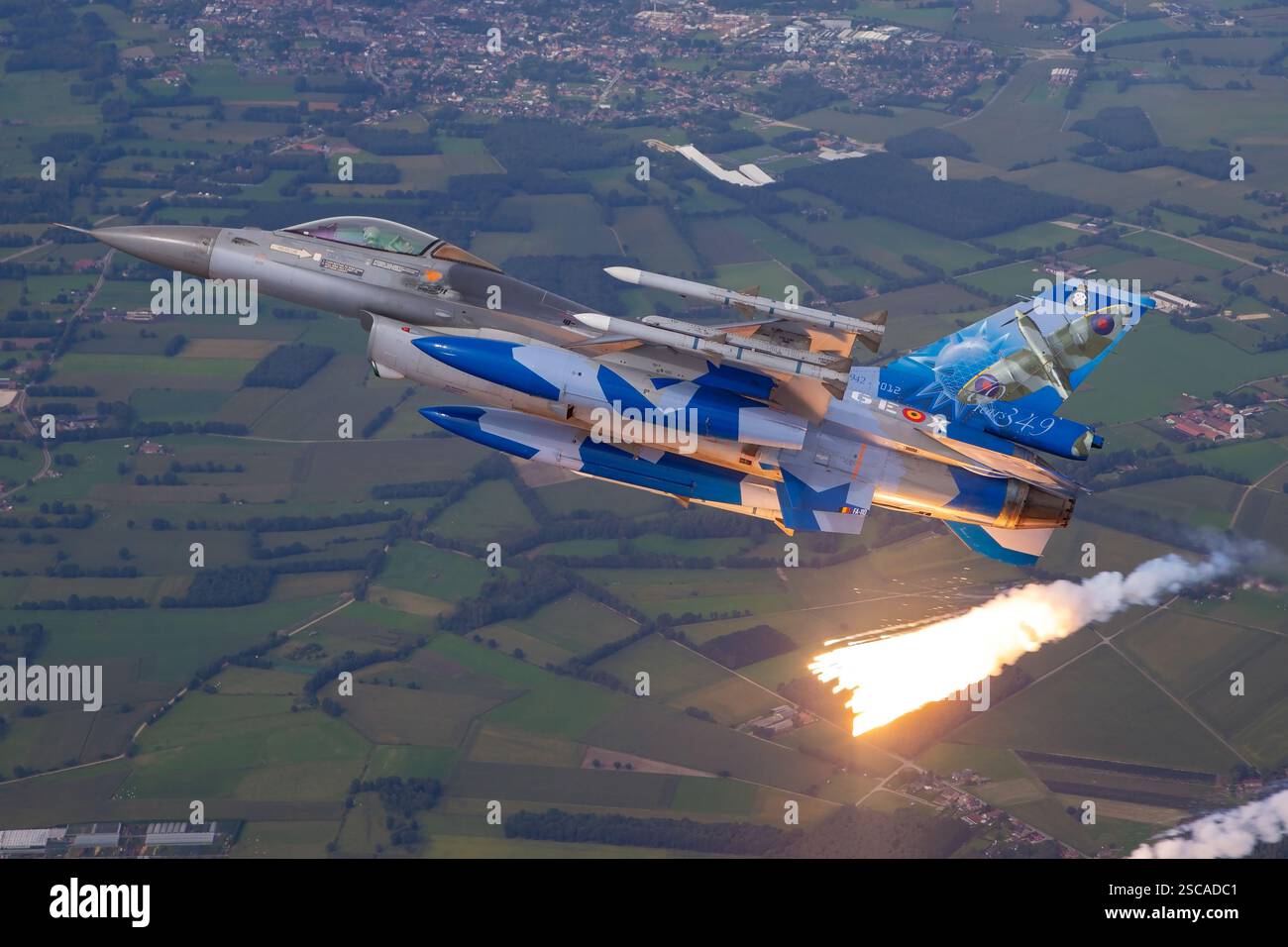 Belgian Air Force F-16 Fighting Falcon releasing flares during an air ...