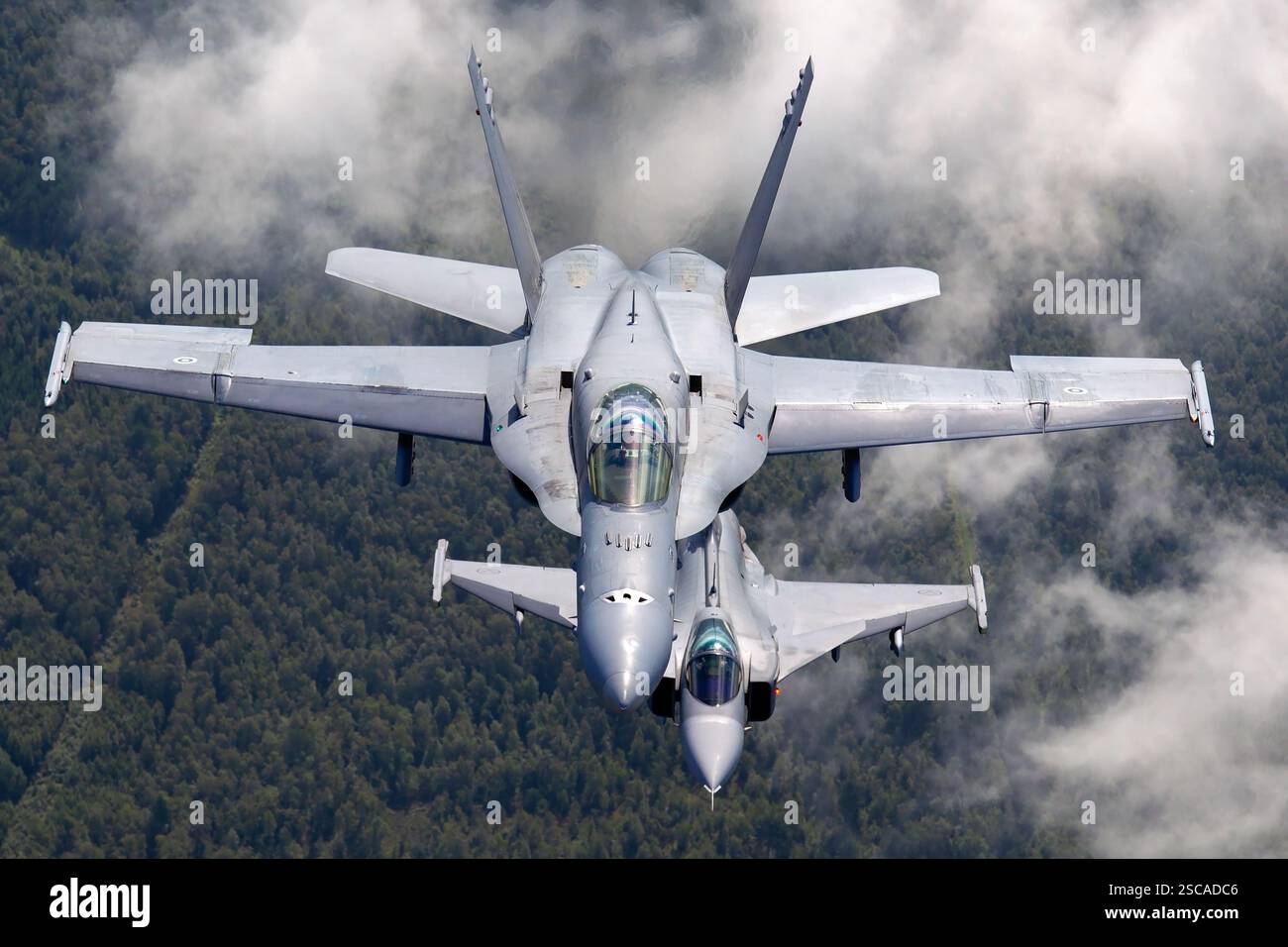 A Finnish Air Force F/A-18 Hornet performing air combat maneuvers ...