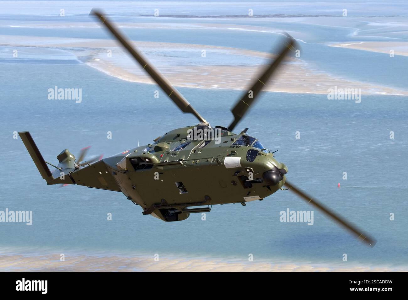 Belgian Air Force NH90 helicopter performing a vertical climb during an ...