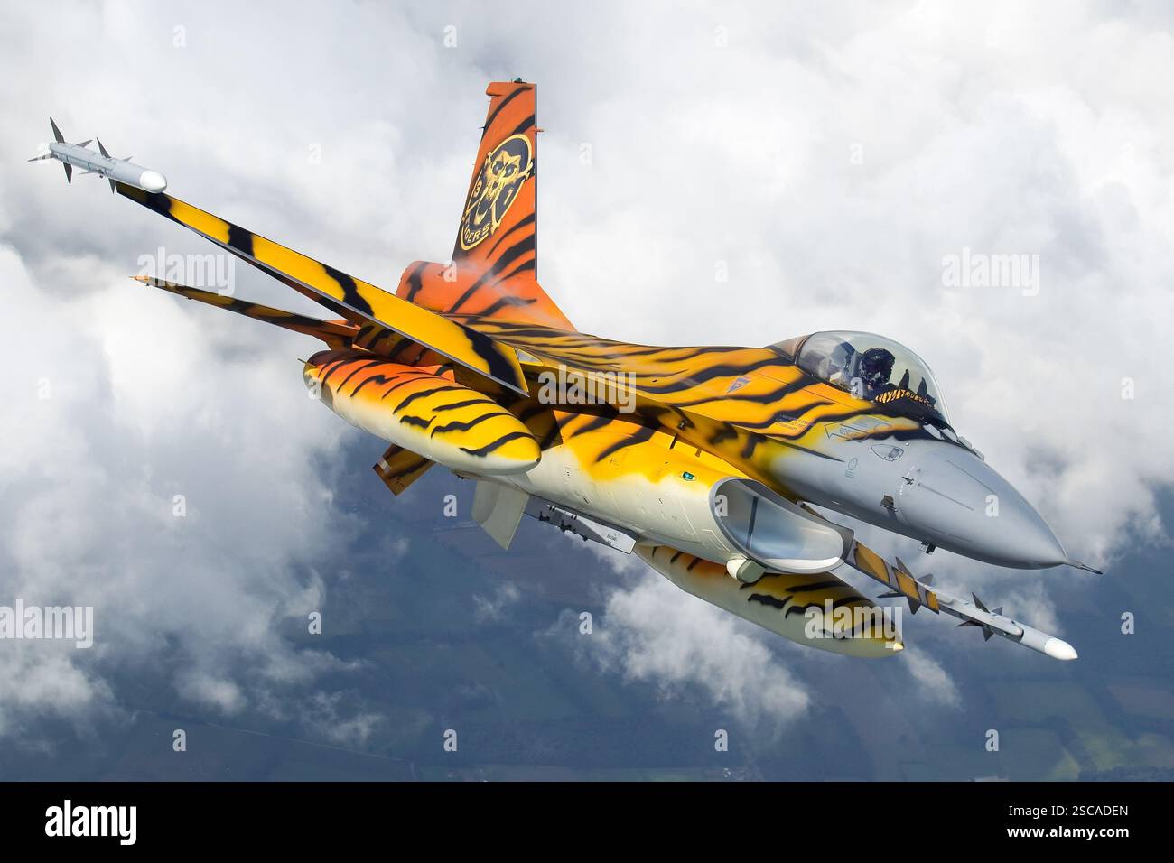 Belgian Air Force F-16 Tiger, flying in a defensive posture during a ...