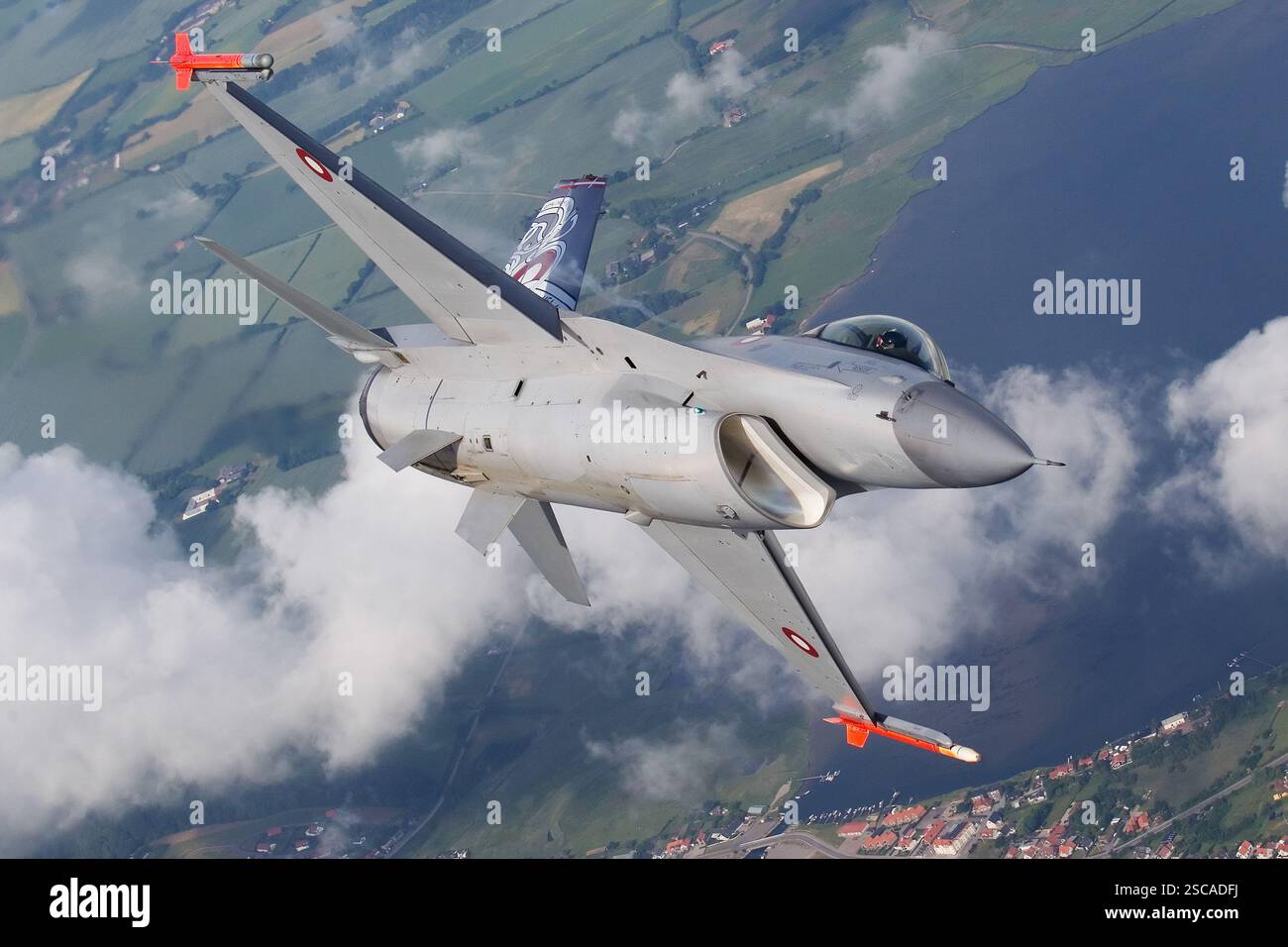 Danish Air Force Lockheed Martin F-16 Fighting Falcon performing a high ...
