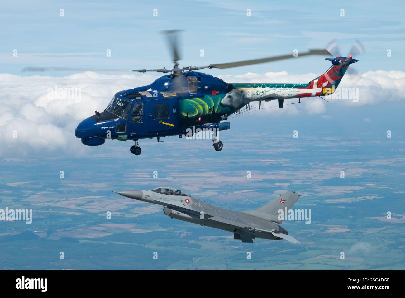 A Danish Air Force Westland Lynx helicopter and F-16 Fighting Falcon in ...