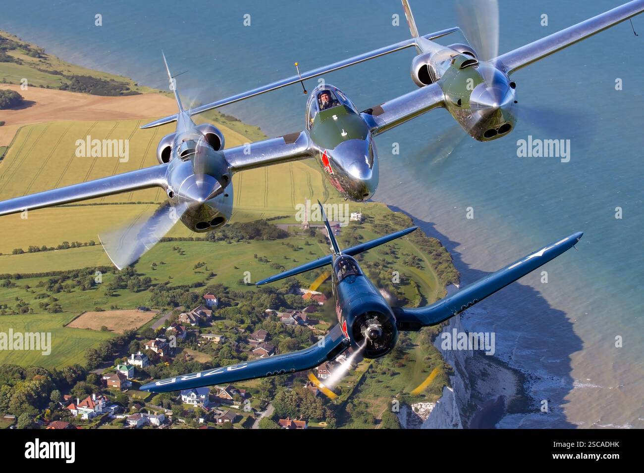 Flying Bulls-operated P-38 Corsair flying over the white cliffs of Dover during an air-to-air ...