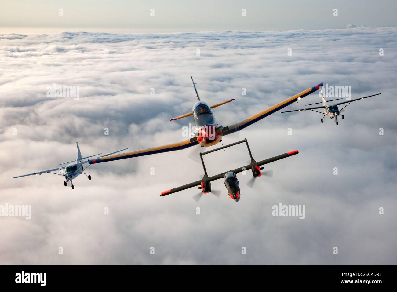 4-ship formation of Pilatus PC-9, Rockwell OV-10 Bronco, and Cessna ...