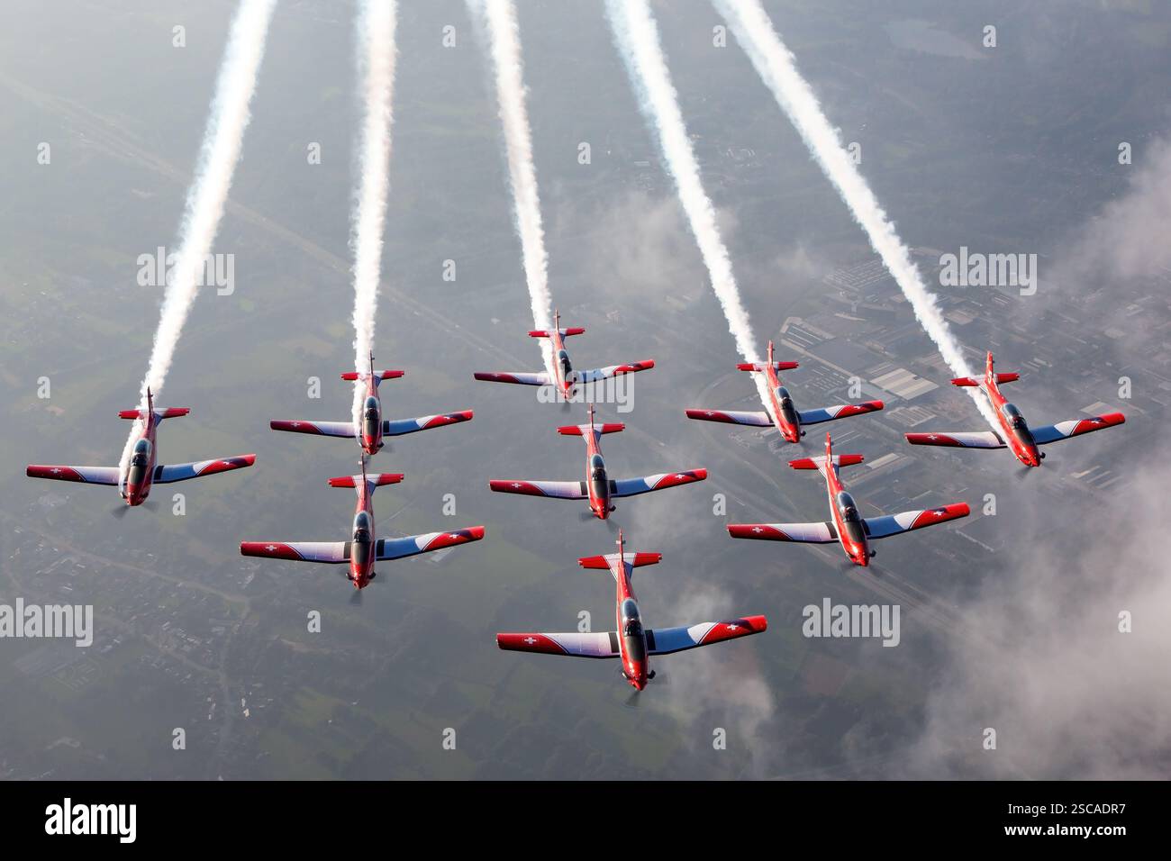 The Swiss Air Force PC-7 Team executing precision aerobatic formations in their Pilatus PC-7 ...