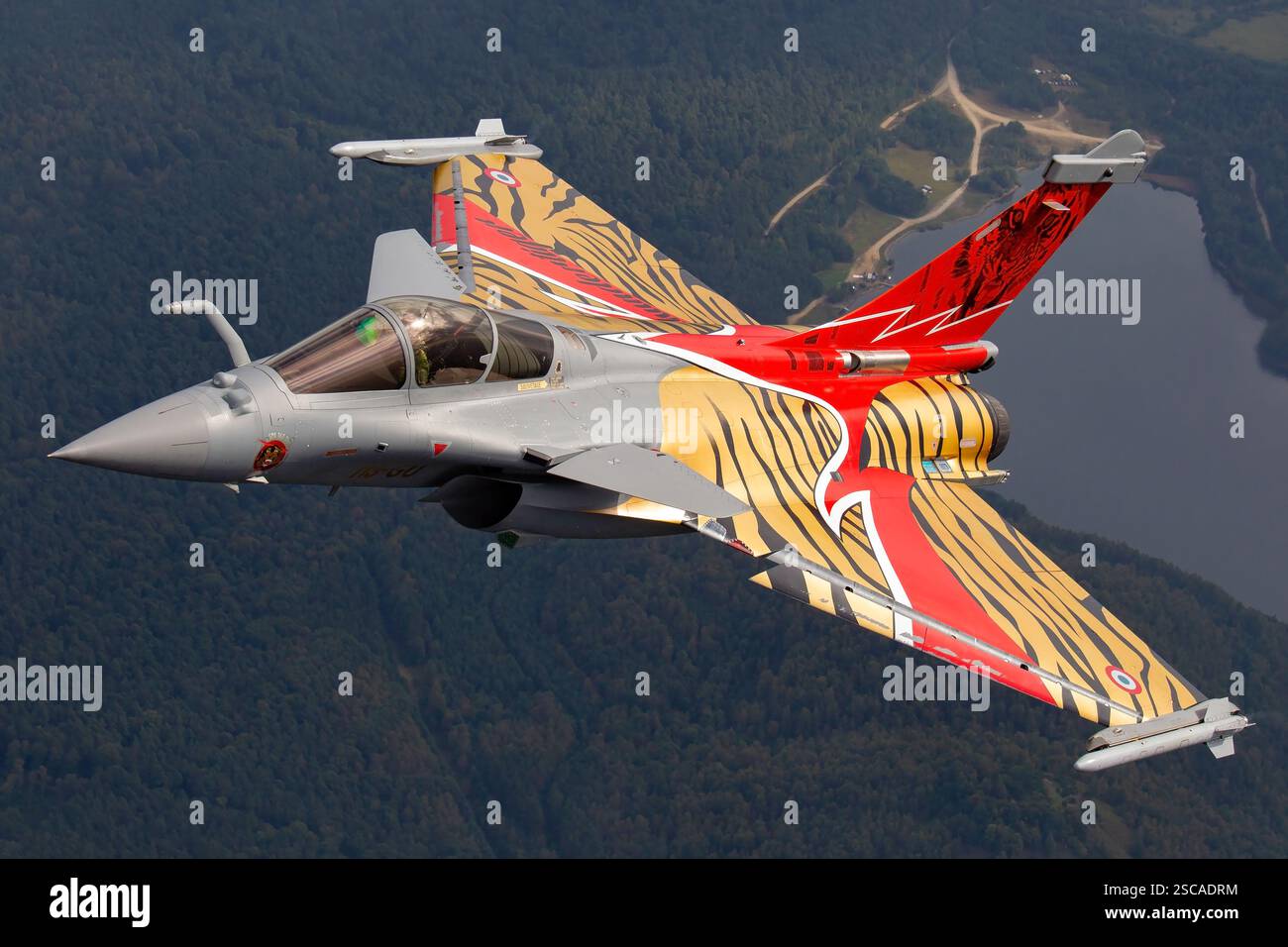 A French Air Force Dassault Rafale fighter jet soaring through the sky ...