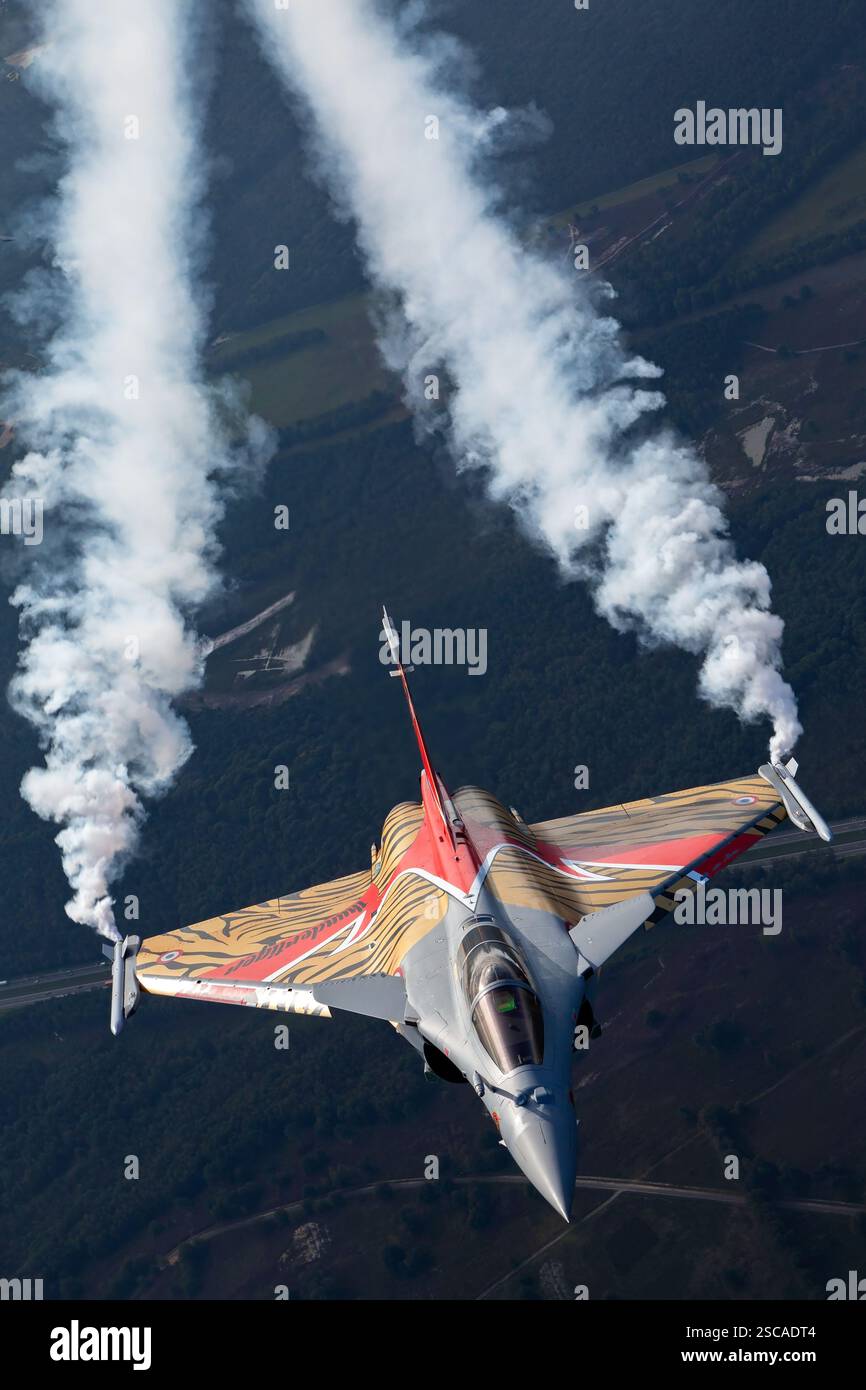 A French Air Force Dassault Rafale fighter jet in full flight, powered ...