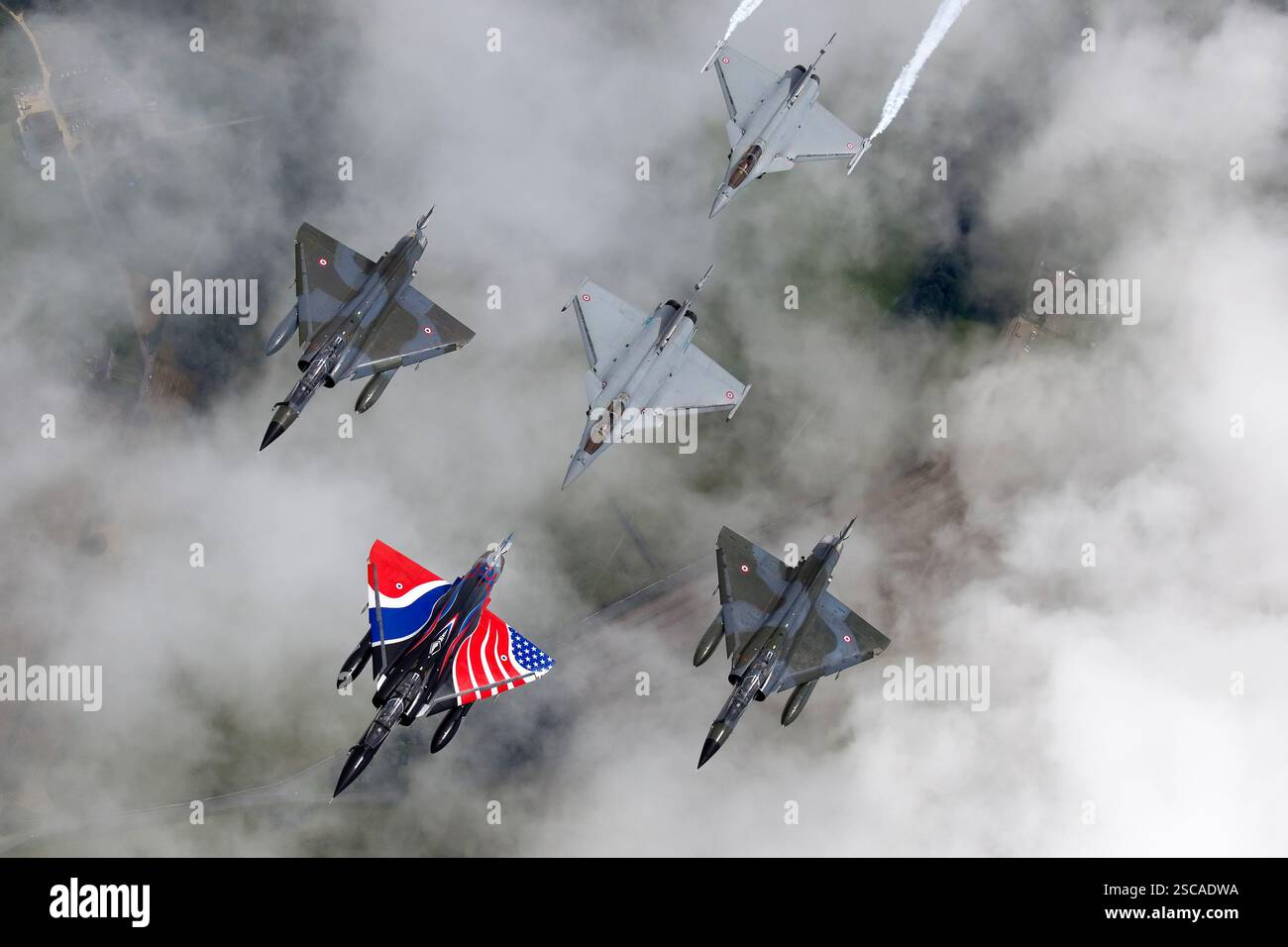 French Air Force Mirage 2000 and Dassault Rafale in formation flight ...