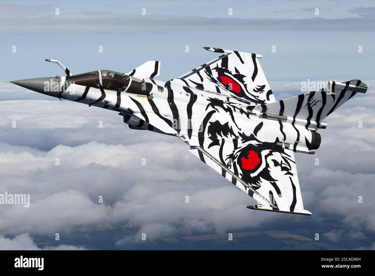 A French Navy Dassault Rafale soaring through the sky with full ...
