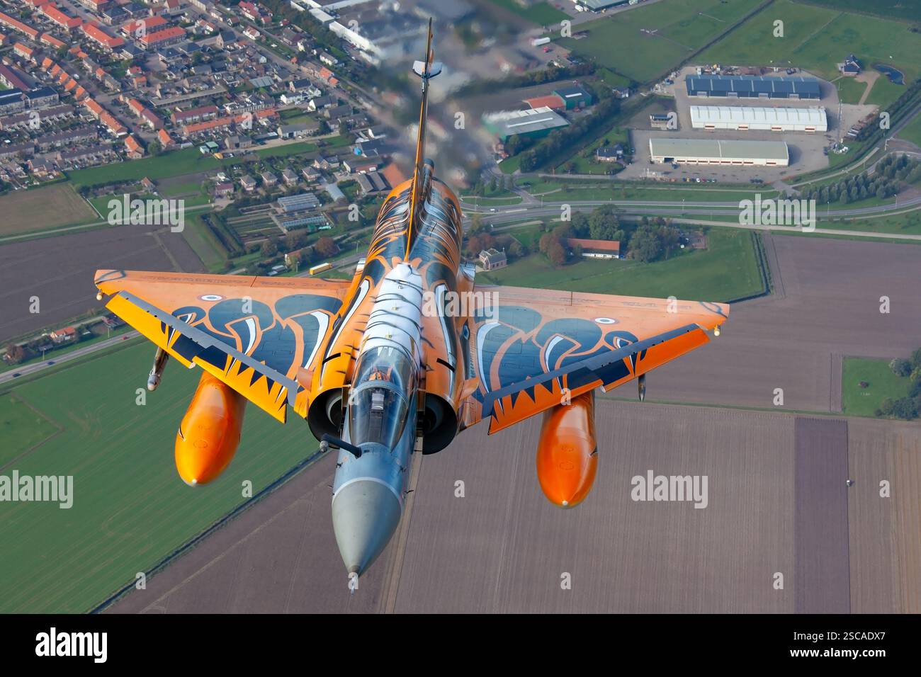 French Air Force Mirage 2000 fighter jet performing aerobatic maneuvers ...