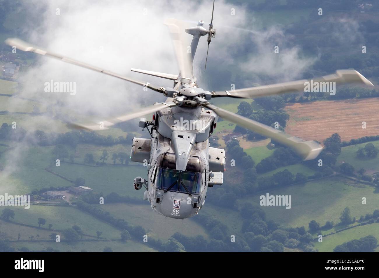 A Royal Navy Merlin helicopter in flight, showcasing its role in ...