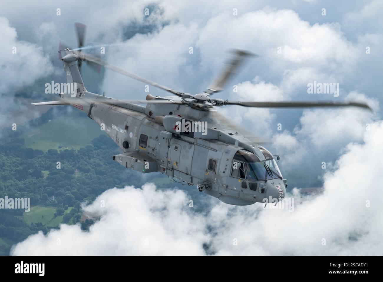 Royal Navy Merlin helicopter conducting a vertical replenishment Stock ...