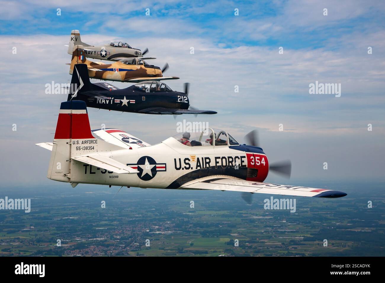 A 4-ship formation of T-28 Trojan aircraft flying in tight formation ...