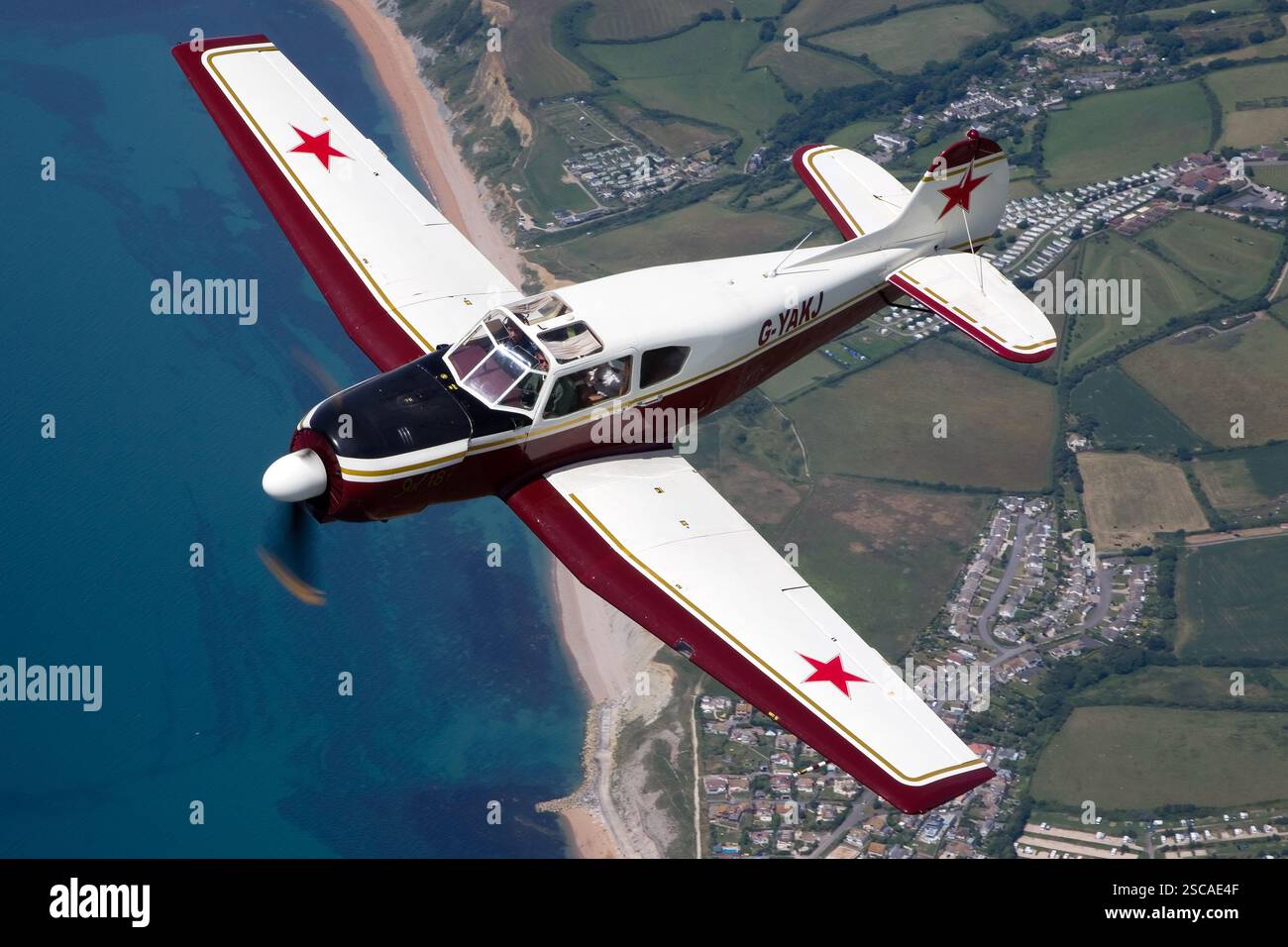 A Yakovlev Yak-18T, a Soviet-era tandem-seat trainer aircraft, captured ...