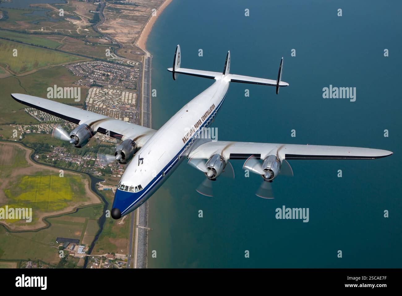 A Lockheed Super Constellation flying through the sky during an air-to ...