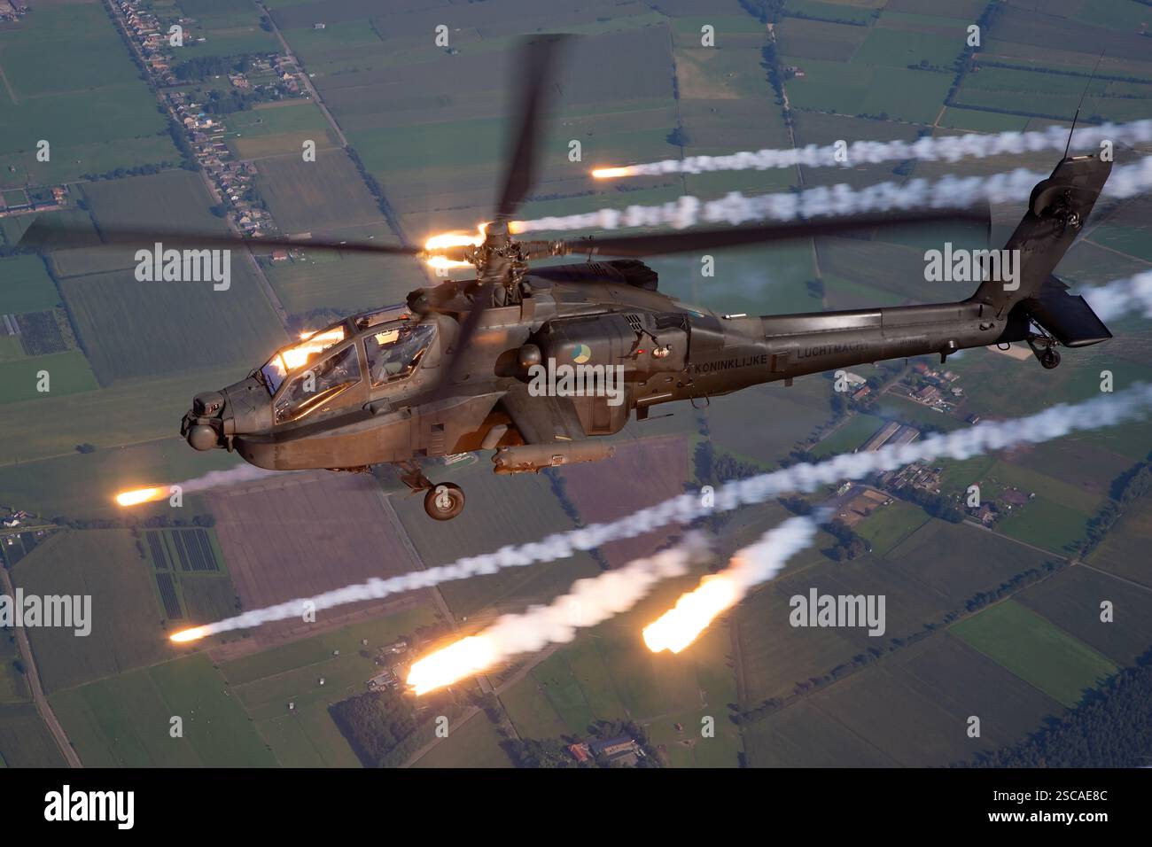 Royal Netherlands Air Force Apache AH-64D releasing flares during an ...