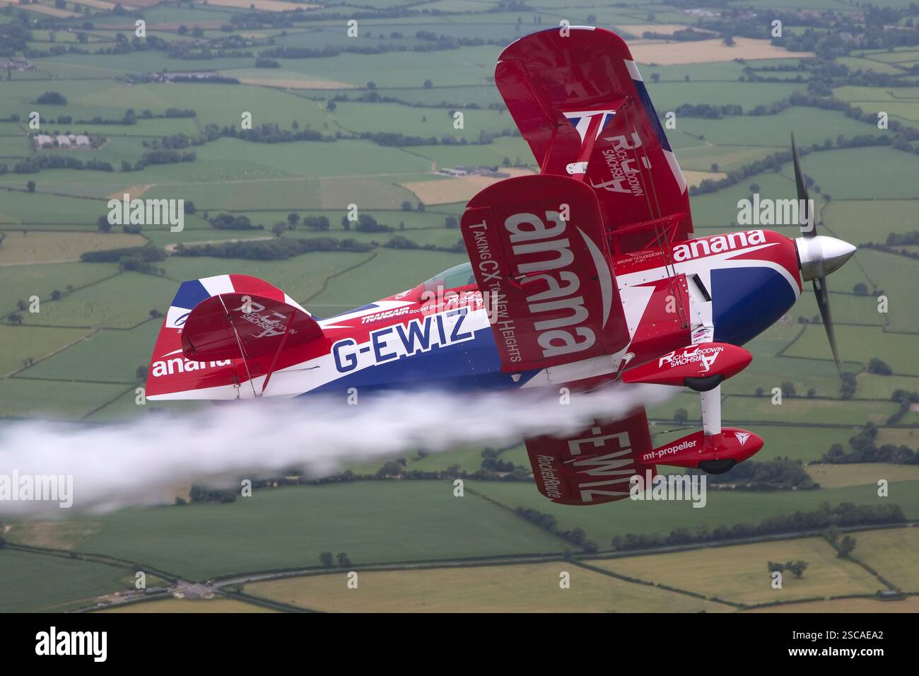 A Pitts Special in flight performing an inverted maneuver. This high ...