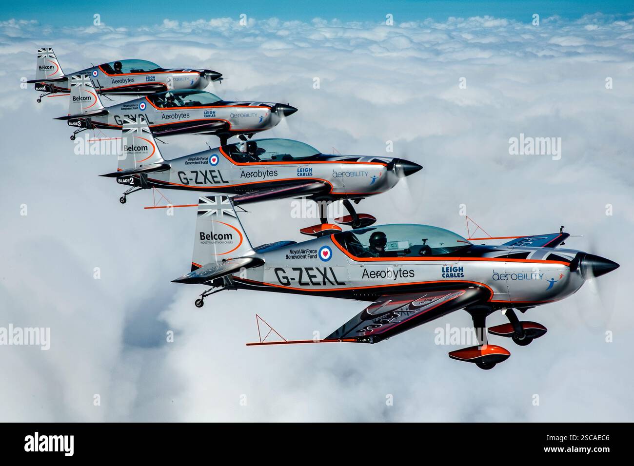 The Blades Aerobatic Team, flying the Extra 330SC, performs high ...
