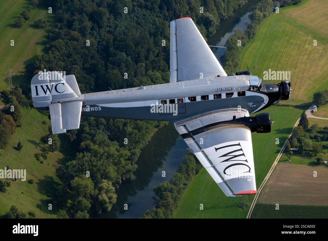 A Junkers Ju-52 aircraft flying during an air-to-air photo shoot. The Ju-52, powered by three ...