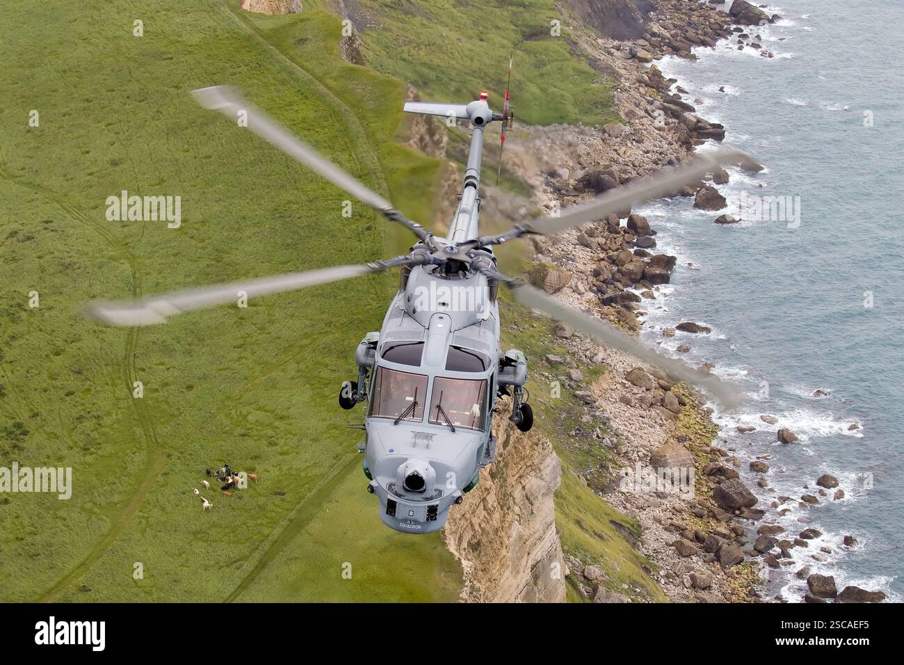 Royal Navy Lynx helicopter flying over the sea, showcasing its ...