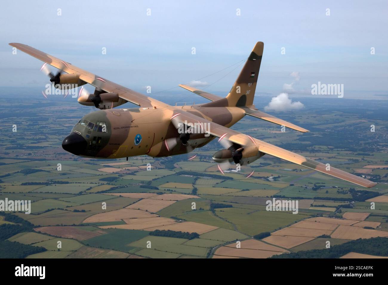 Lockheed C-130 Hercules flying in formation. Powered by four turboprop ...