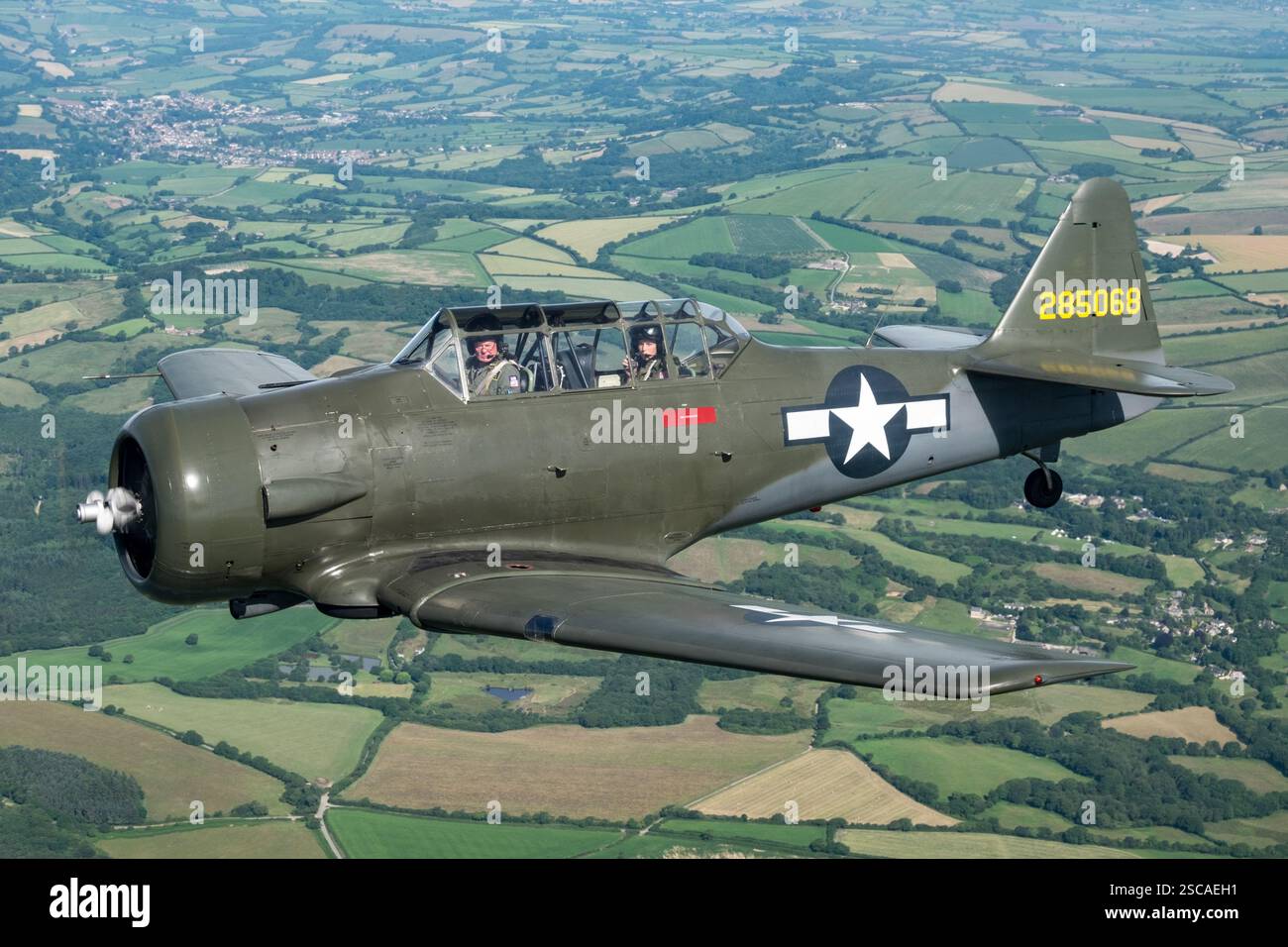 A North American T-6 Harvard, a military training aircraft, in flight ...