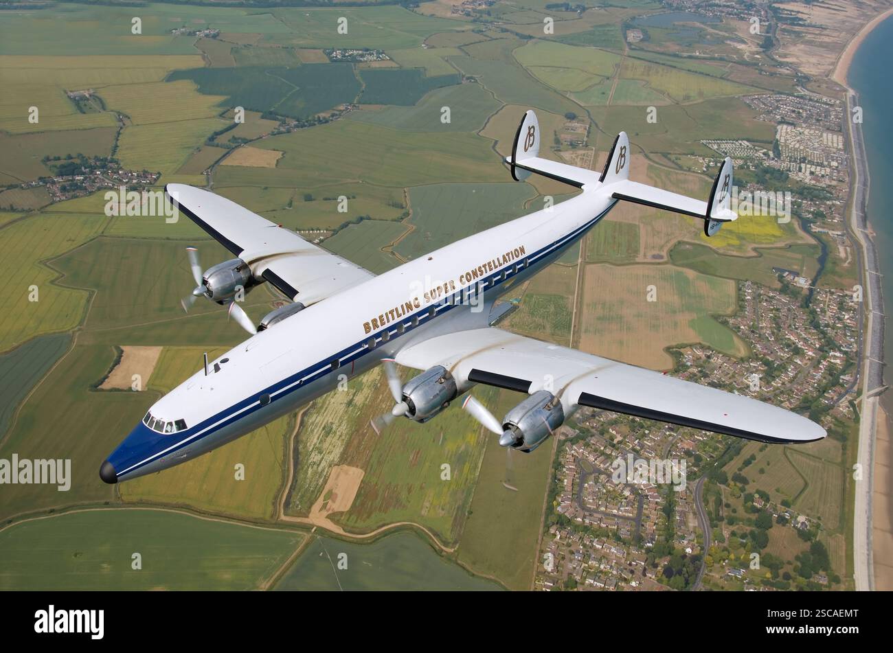 A Lockheed Super Constellation flying through the sky during an air-to ...