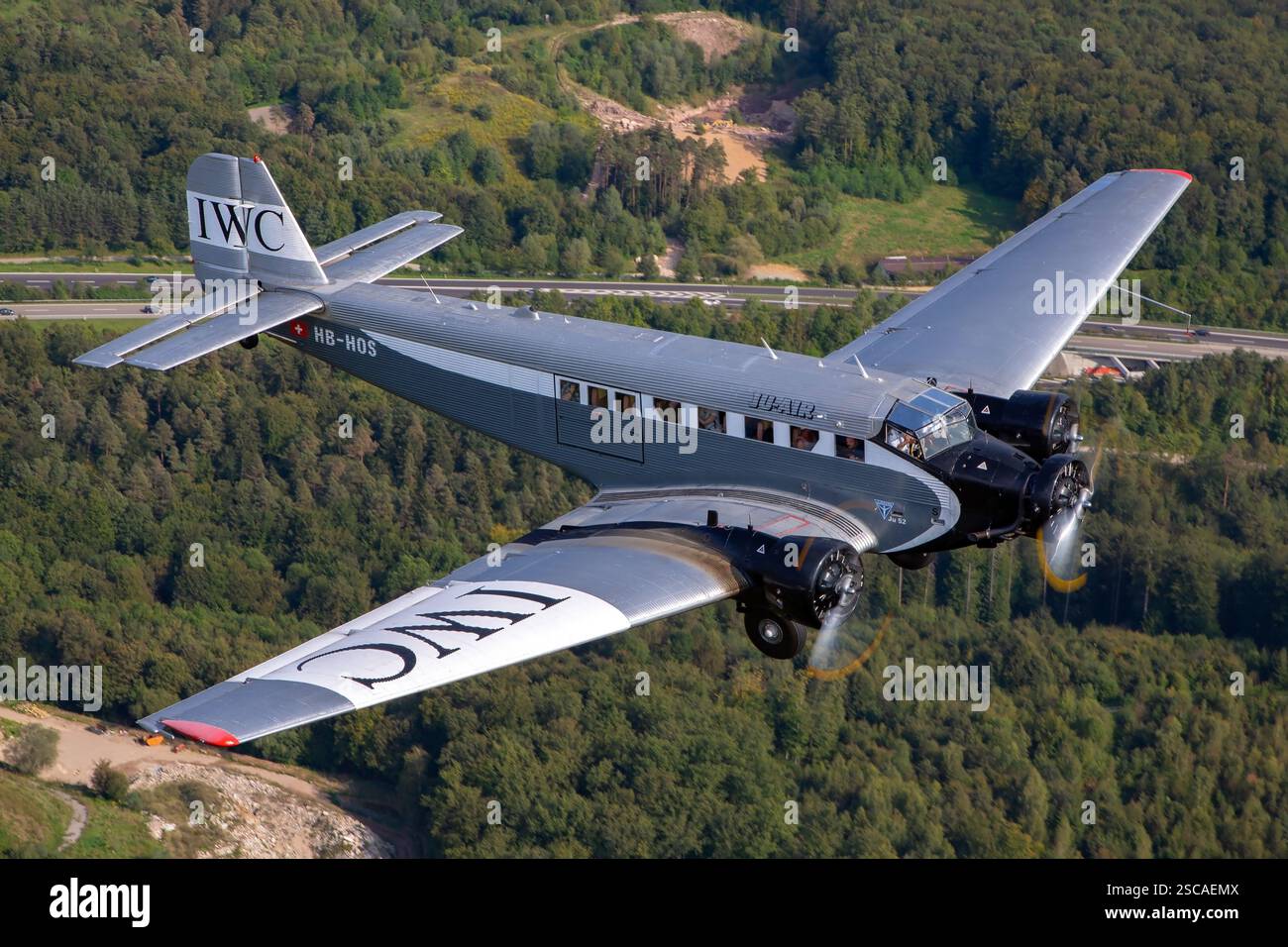 A Junkers Ju-52 flying through the sky during an air-to-air photo shoot. Known as the 'Tante Ju ...