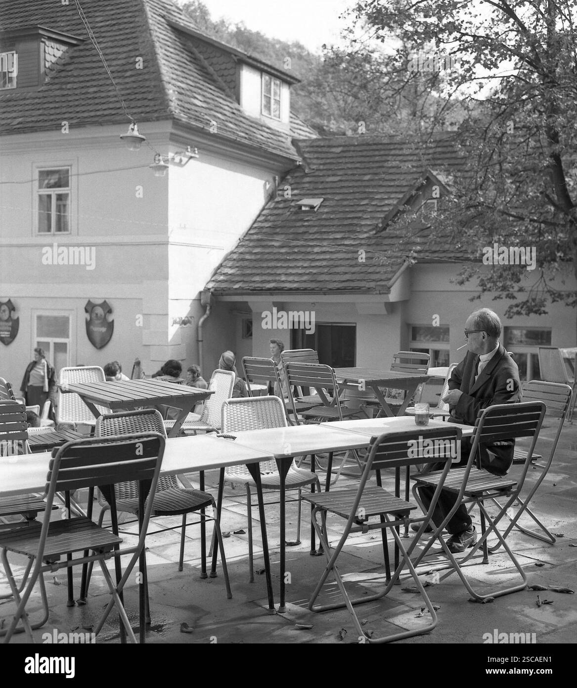 Tables and chairs at the restaurant of castle Karlsteijn in the Czech ...