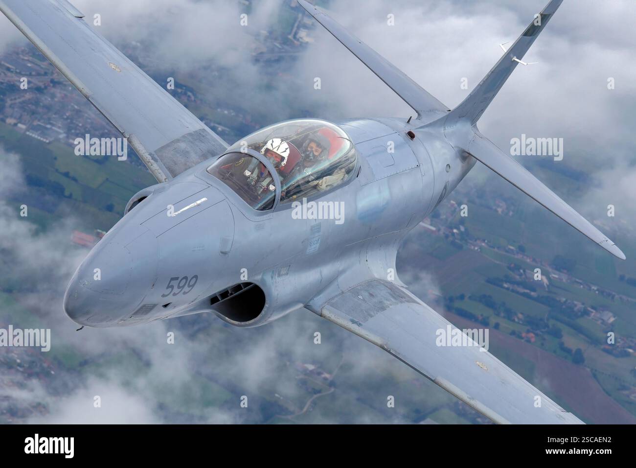 A Lockheed T-33 shooting an air-to-air photo during a high-speed pass ...