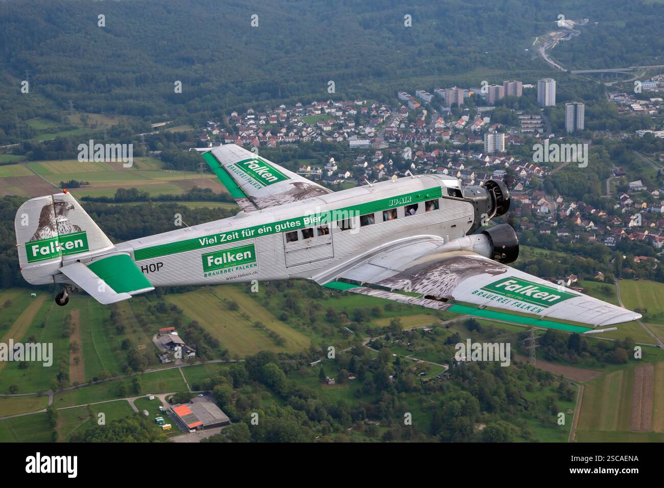 A Junkers Ju-52, known as the 'Tante Ju,' flying during an air-to-air photo shoot. The aircraft ...