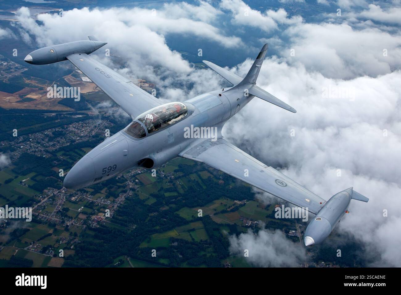 A Lockheed T-33 shooting an air-to-air photo during a high-speed pass. The T-33 is a jet trainer ...