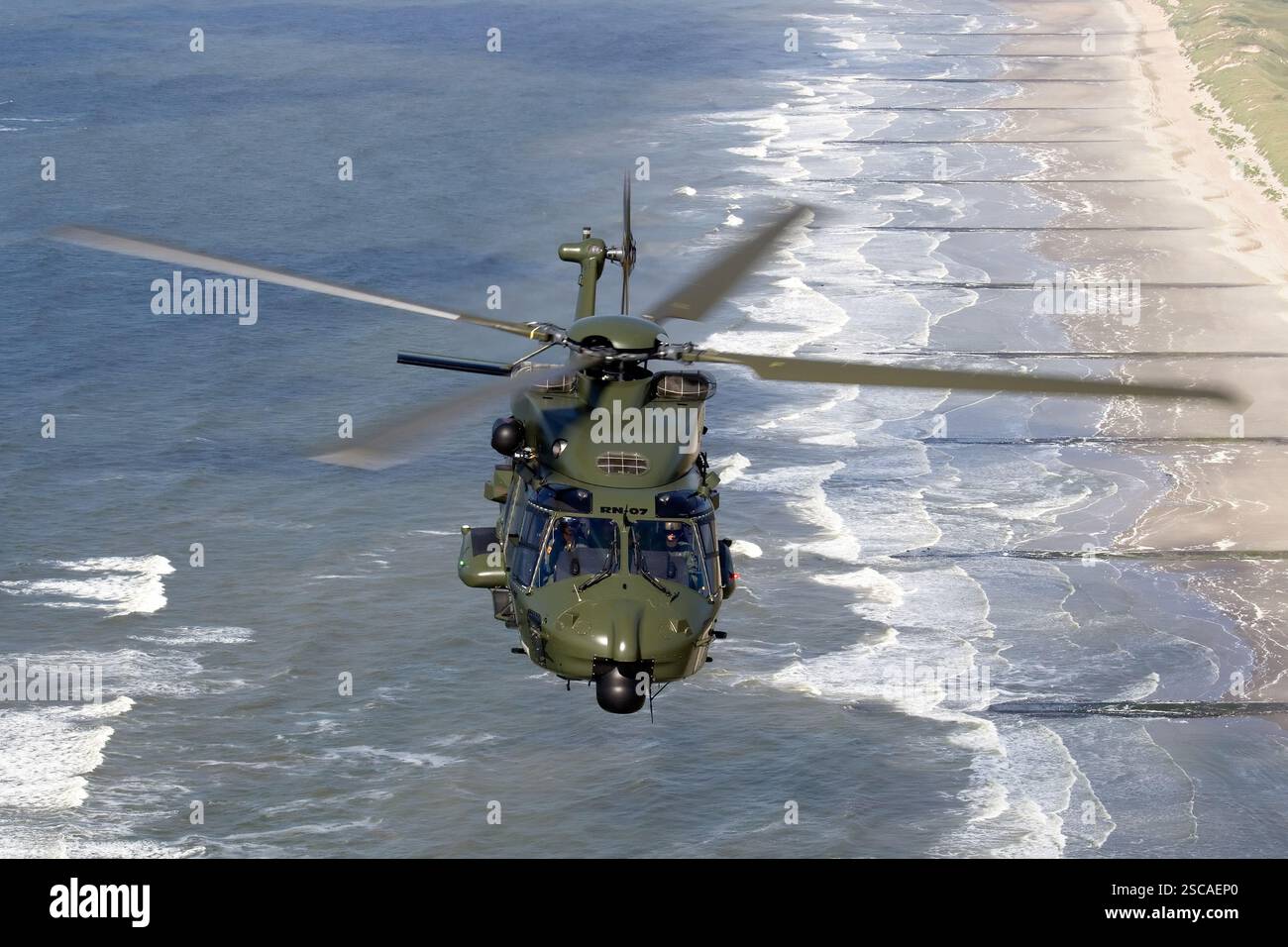 Belgian Air Force NH90 performing a hover in an air-to-air photo shoot ...