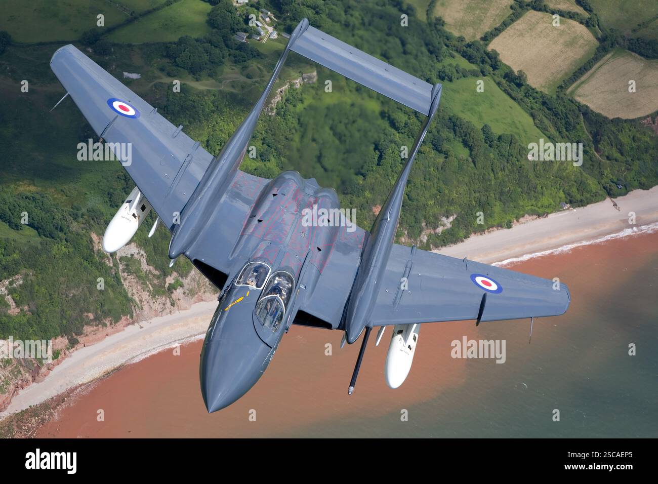 Sea Vixen flying over the ocean, displaying its distinctive twin-boom ...